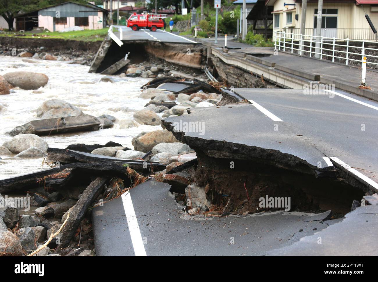 A photo shows a road destroyed by Typhoon Lionrock in Kamaishi, Iwate ...