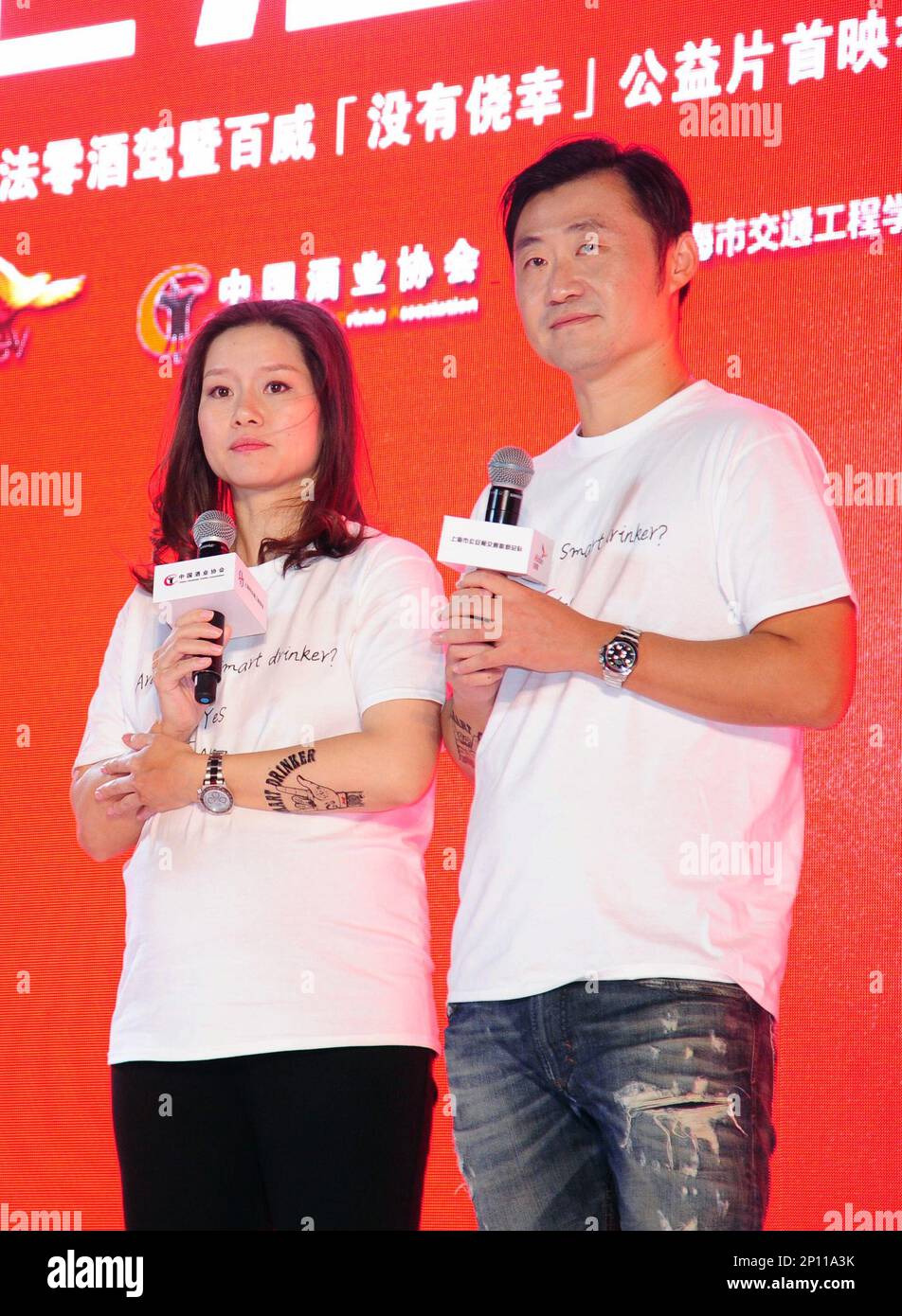 Pregnant retired Chinese tennis superstar Li Na, left, and her husband ...