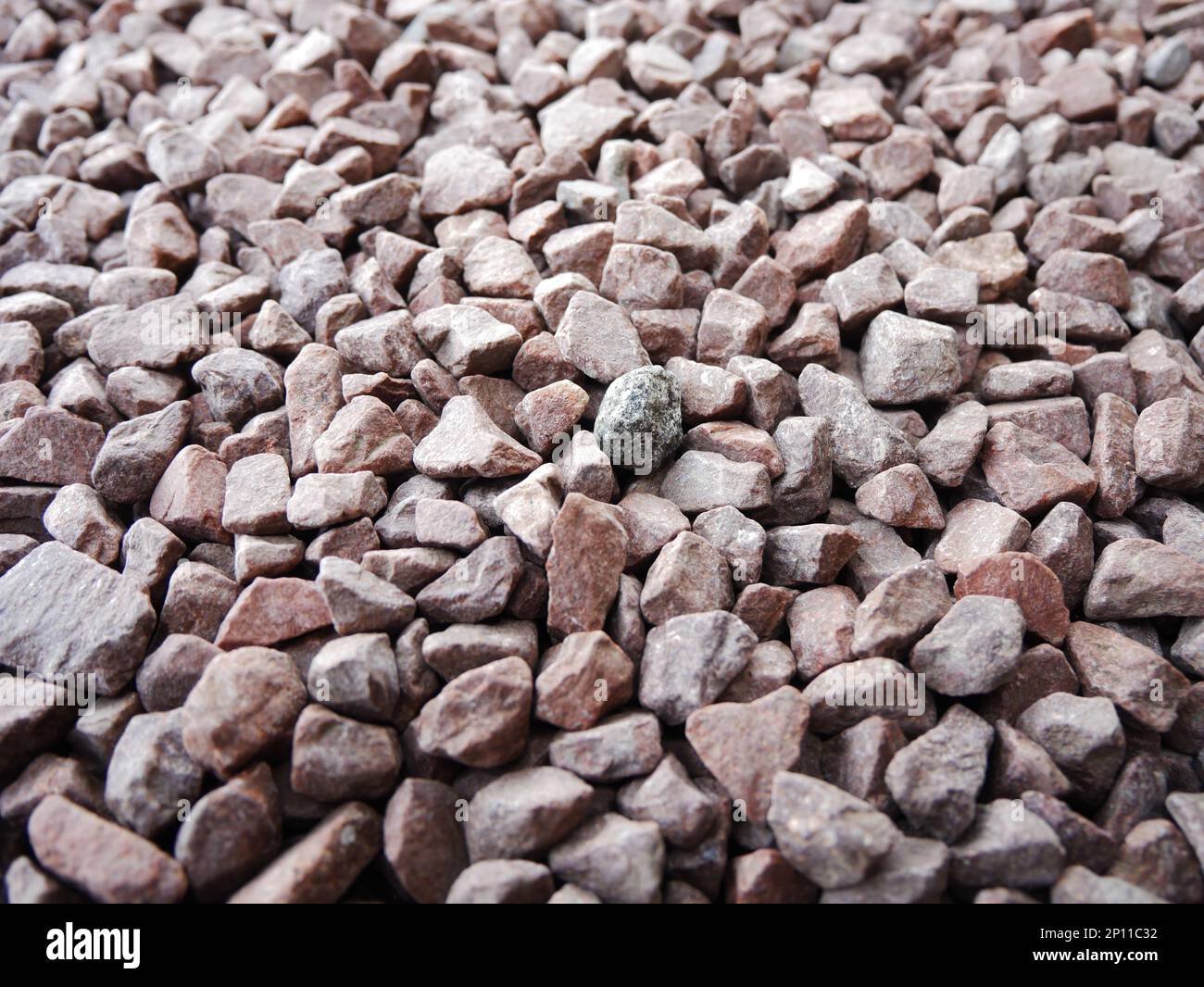 Red and grey stones on a beach. Great background. Associations with ...