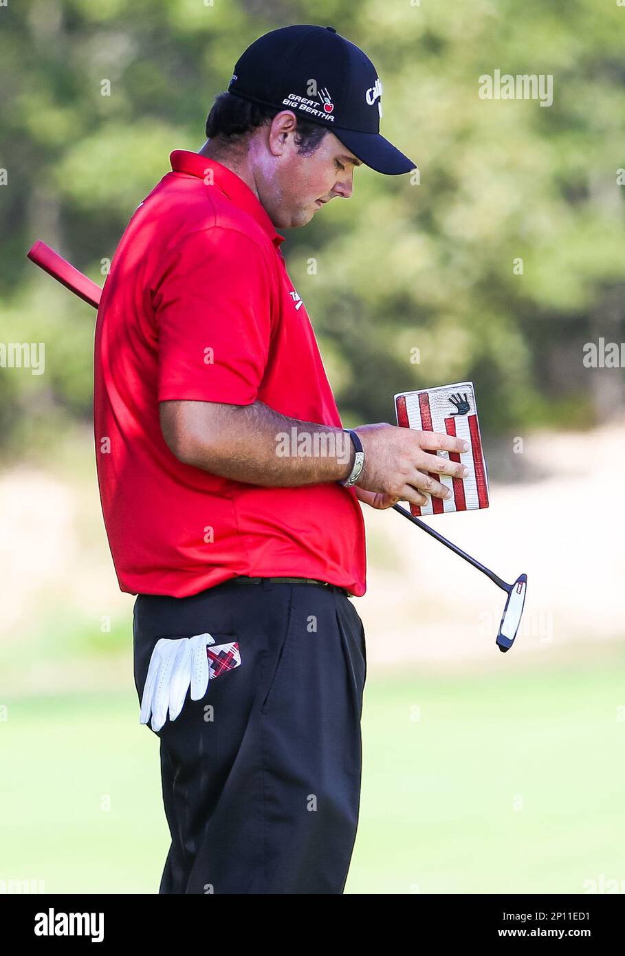 August 28, 2016: Patrick Reed checks his yardage book before putting on ...
