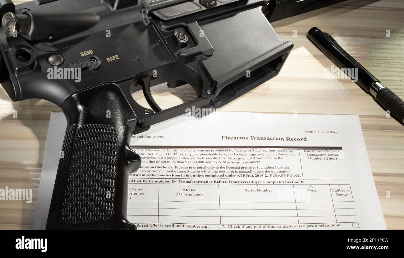 AR-15 with pen and public domain background check form Stock Photo - Alamy