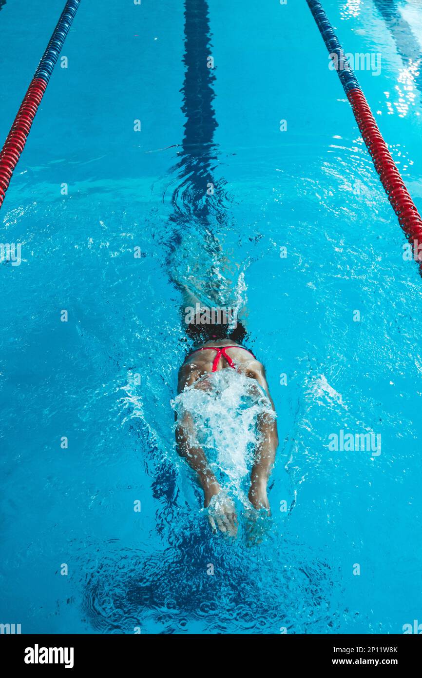 Successful female swimmer swimming in the pool. A professional athlete ...