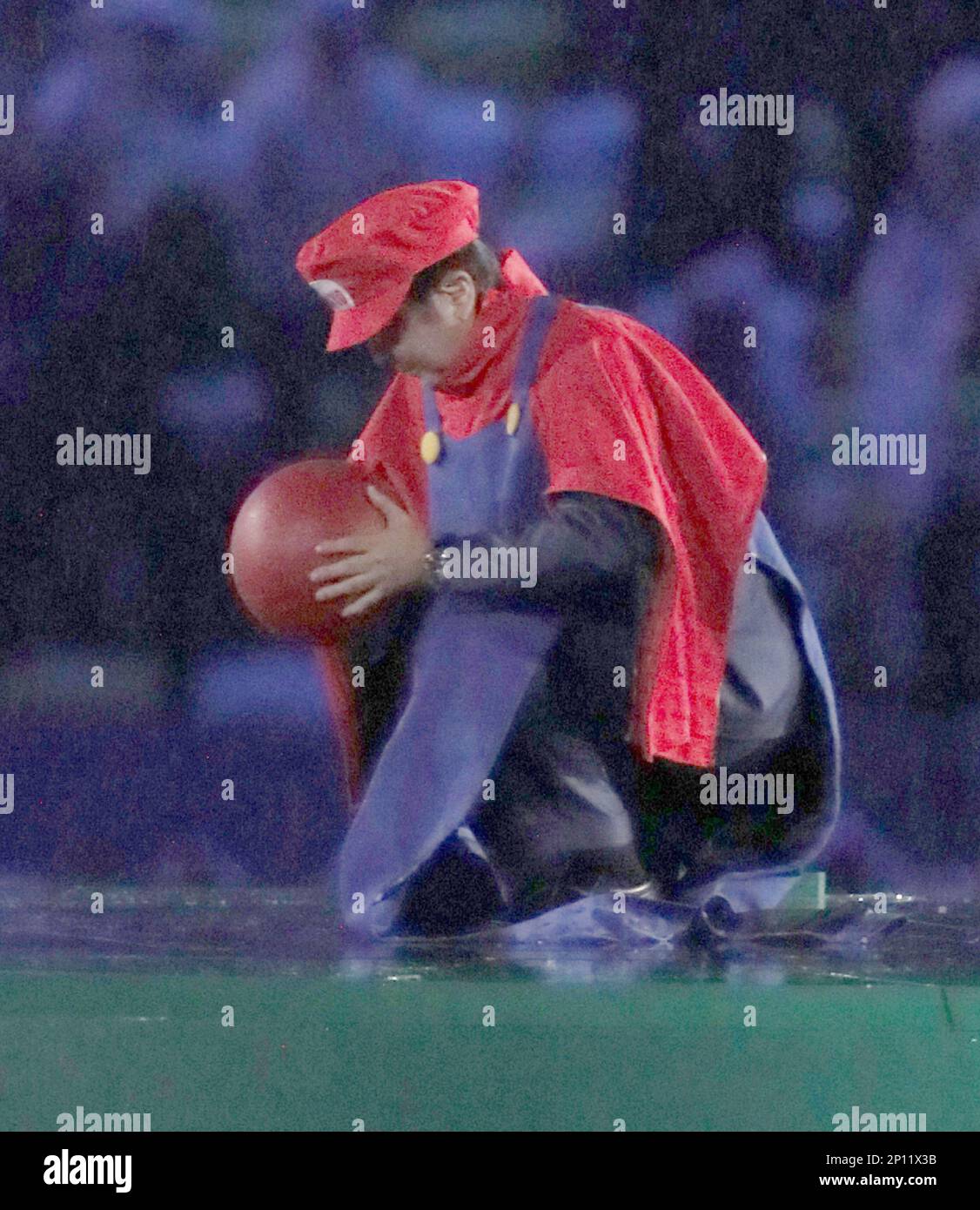 Japanese Prime Minister Shinzo Abe, in the disguise of Super Mario, an ...