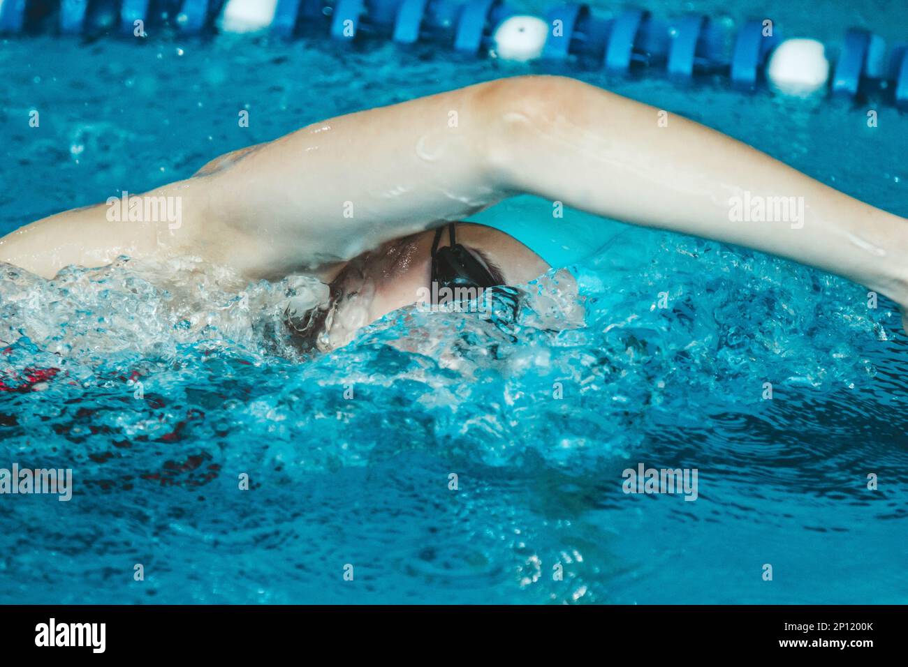 Successful female swimmer swimming in the pool. A professional athlete ...