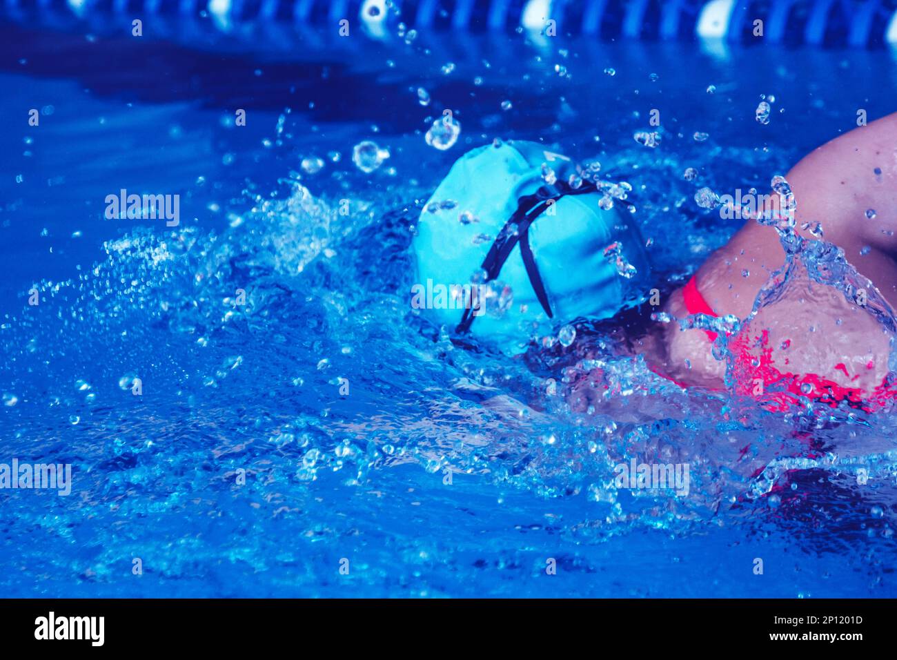 Successful female swimmer swimming in the pool. A professional athlete ...