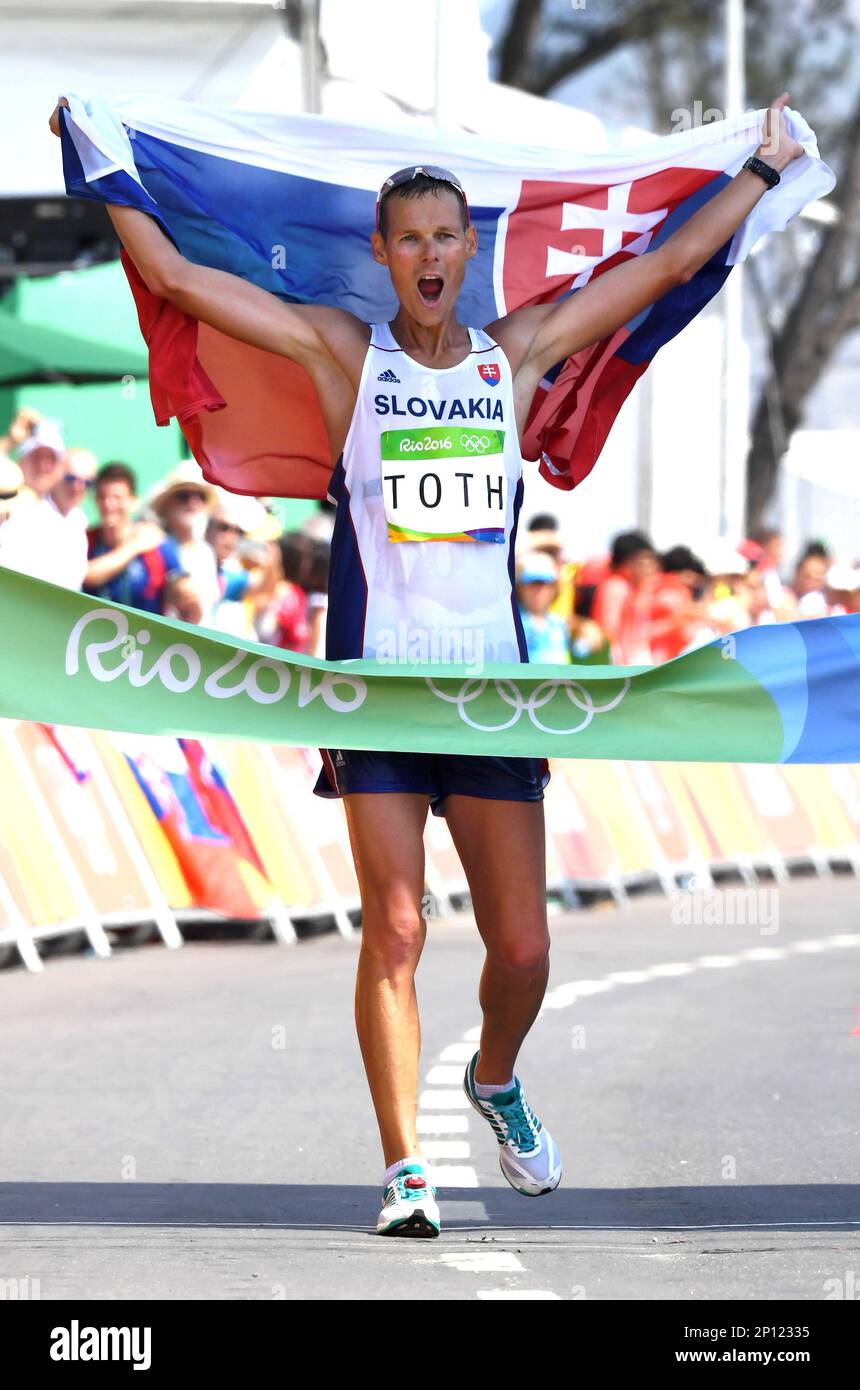 Matej Toth of Slovakia crosses the finish line to win the gold medal in ...