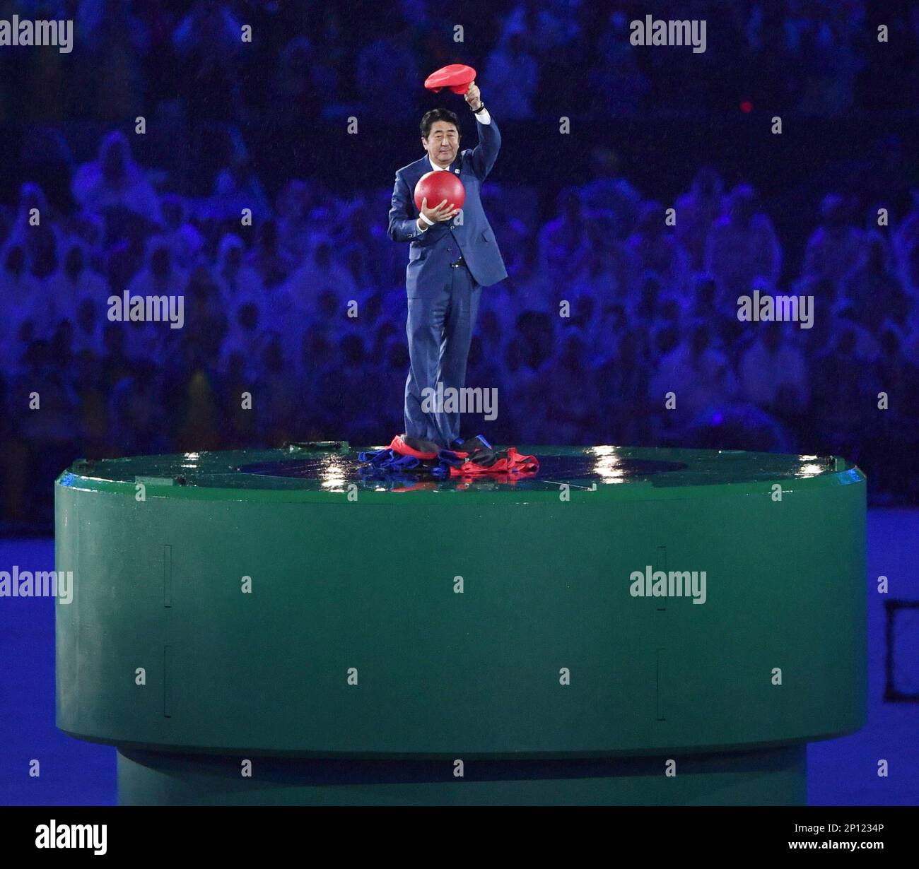 Japanese Prime Minister Shinzo Abe poses just after removing the ...