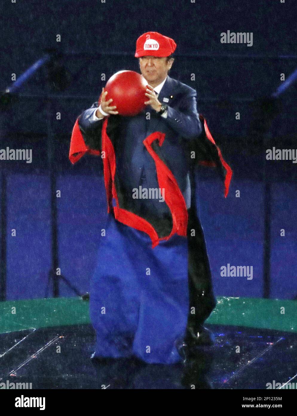 Japanese Prime Minister Shinzo Abe removes costume of the Nintendo game ...