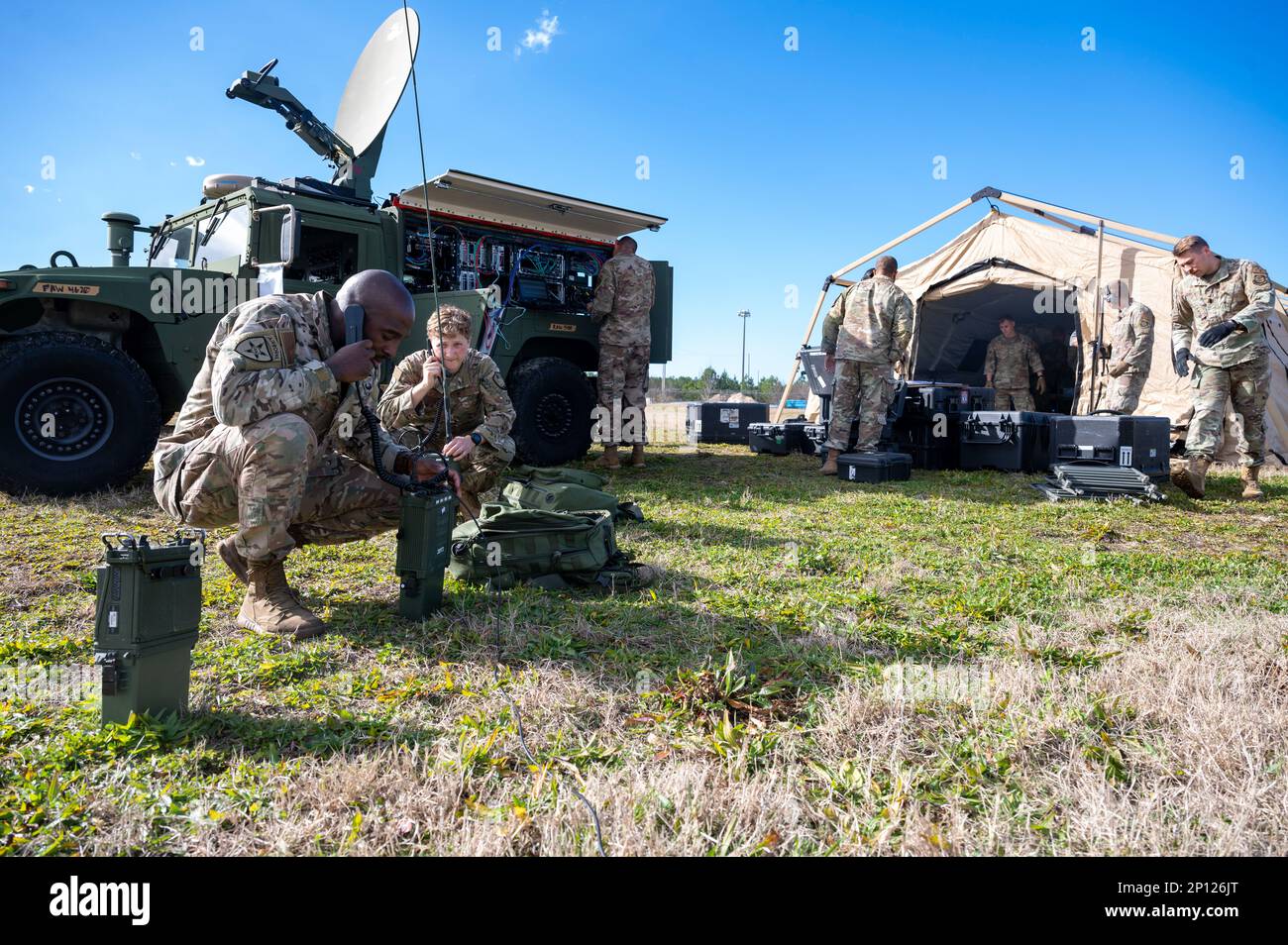 U.S. Air Force Airmen set up a mobile communications antenna for a ...