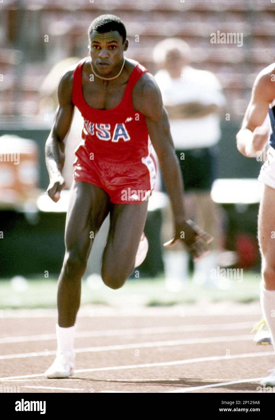 Sprinter Carl Lewis runs in a 400-meter relay race in LosAngeles in ...