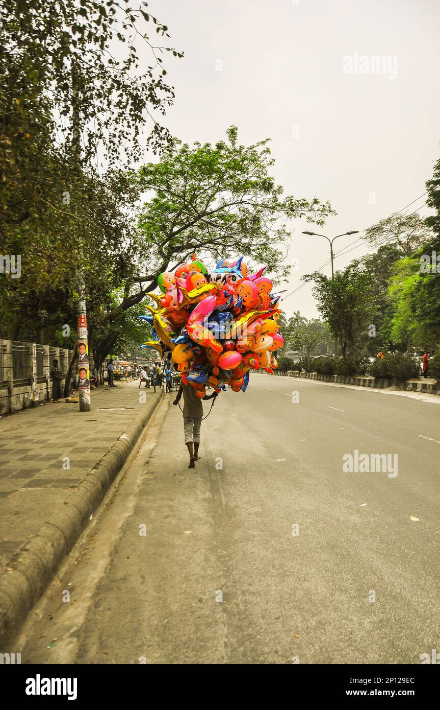 Picture of a balloon seller hawker in a street in Dhaka, Bangladesh ...
