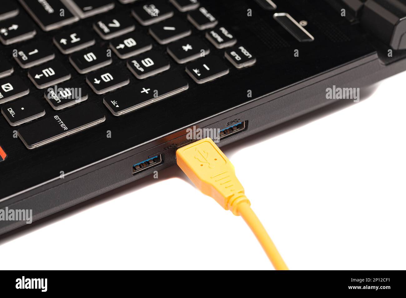 laptop with USB orange cable Stock Photo - Alamy