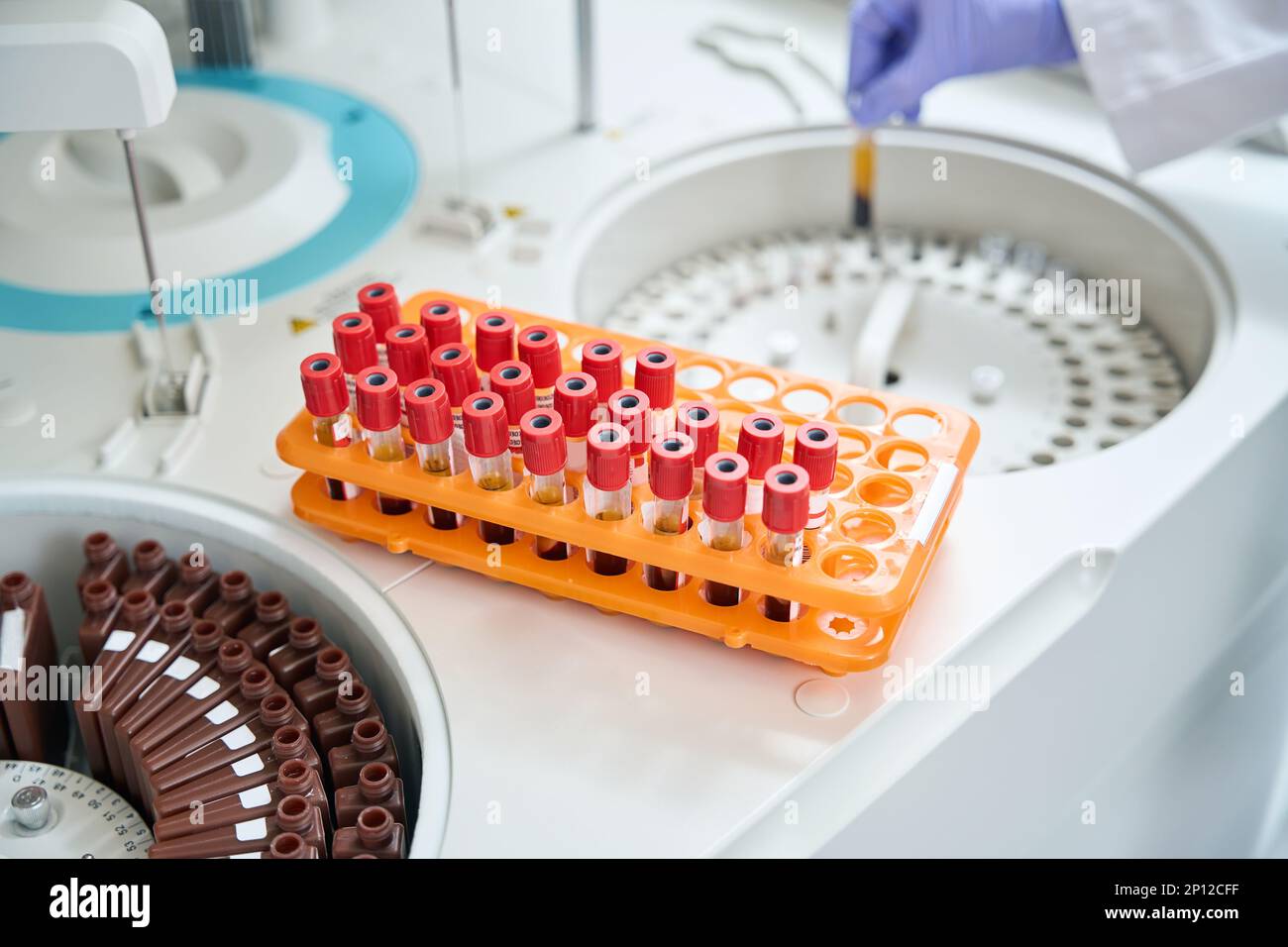 Rack of blood tubes with barcode labels with centrifuge on the ...