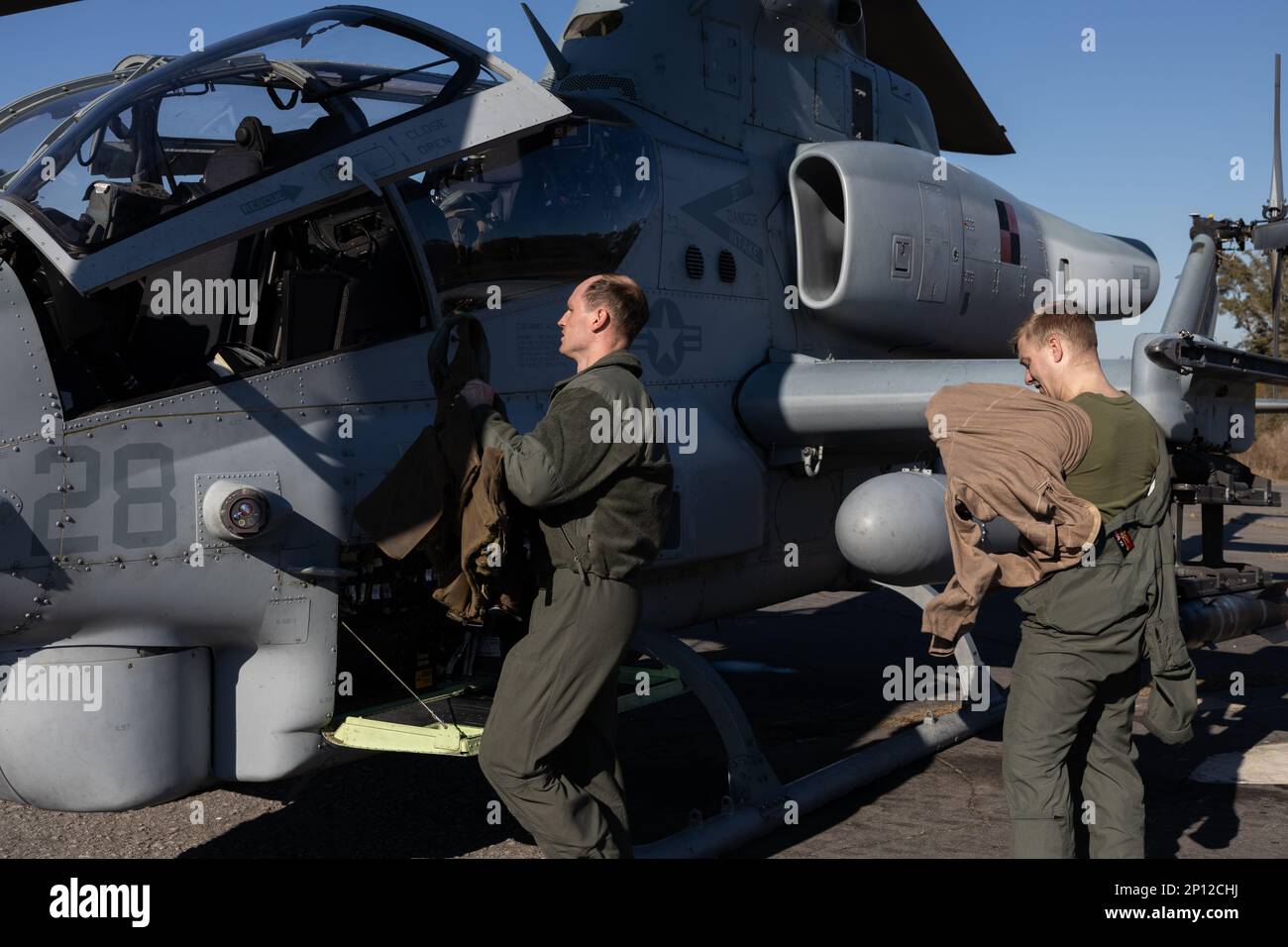U.S. Marine Corps Capt. Ryan Mortensen (left) and Capt. Lawrence ...