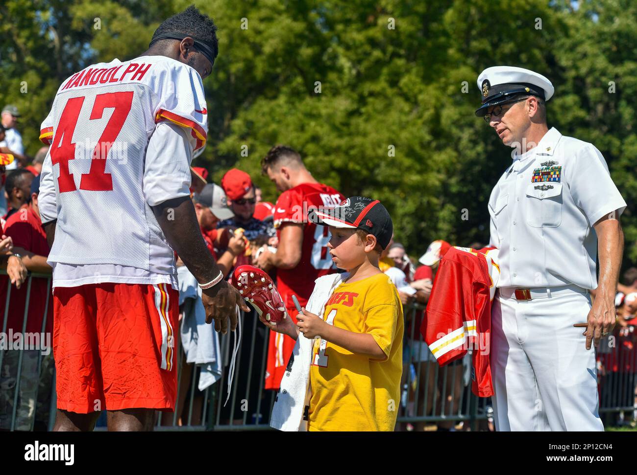 Kansas City Chiefs cornerback Shak Randolph signs a shoe of Benjamin ...