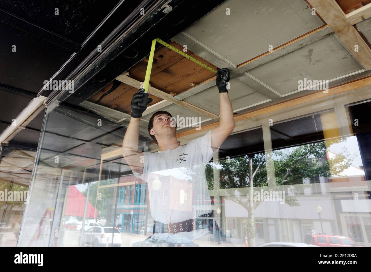 Dylan Sadler, with S & F Construction of Fort Madison, rebuilds the ...