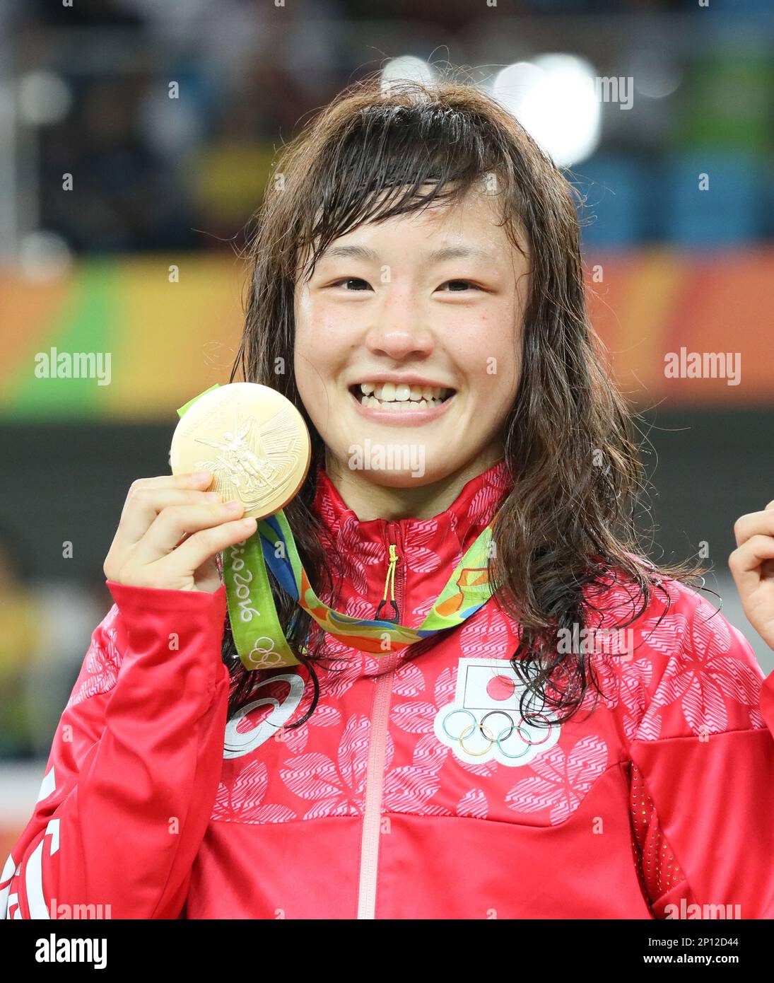 Japan's Eri Tosaka shows her gold medal during the awarding ceremony of ...