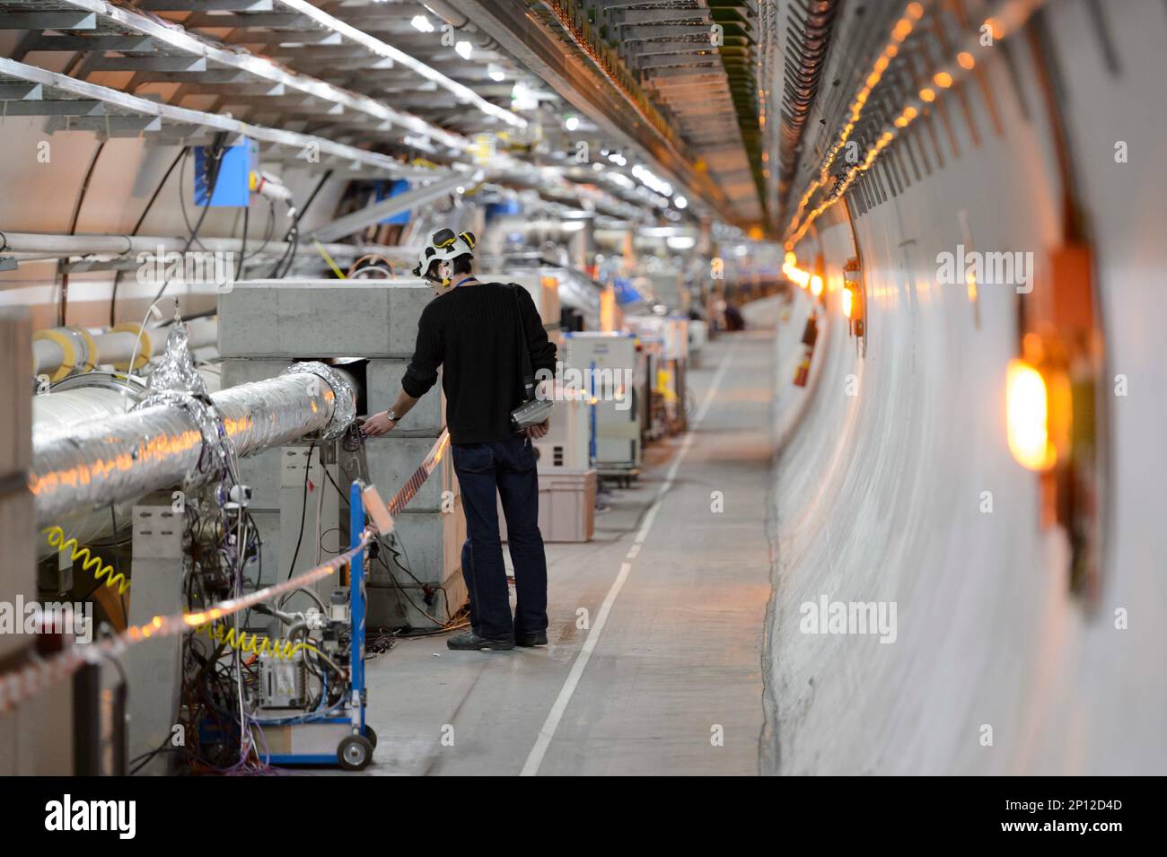 FILE - In this Feb. 16, 2016 file photo a technician works in the LHC ...