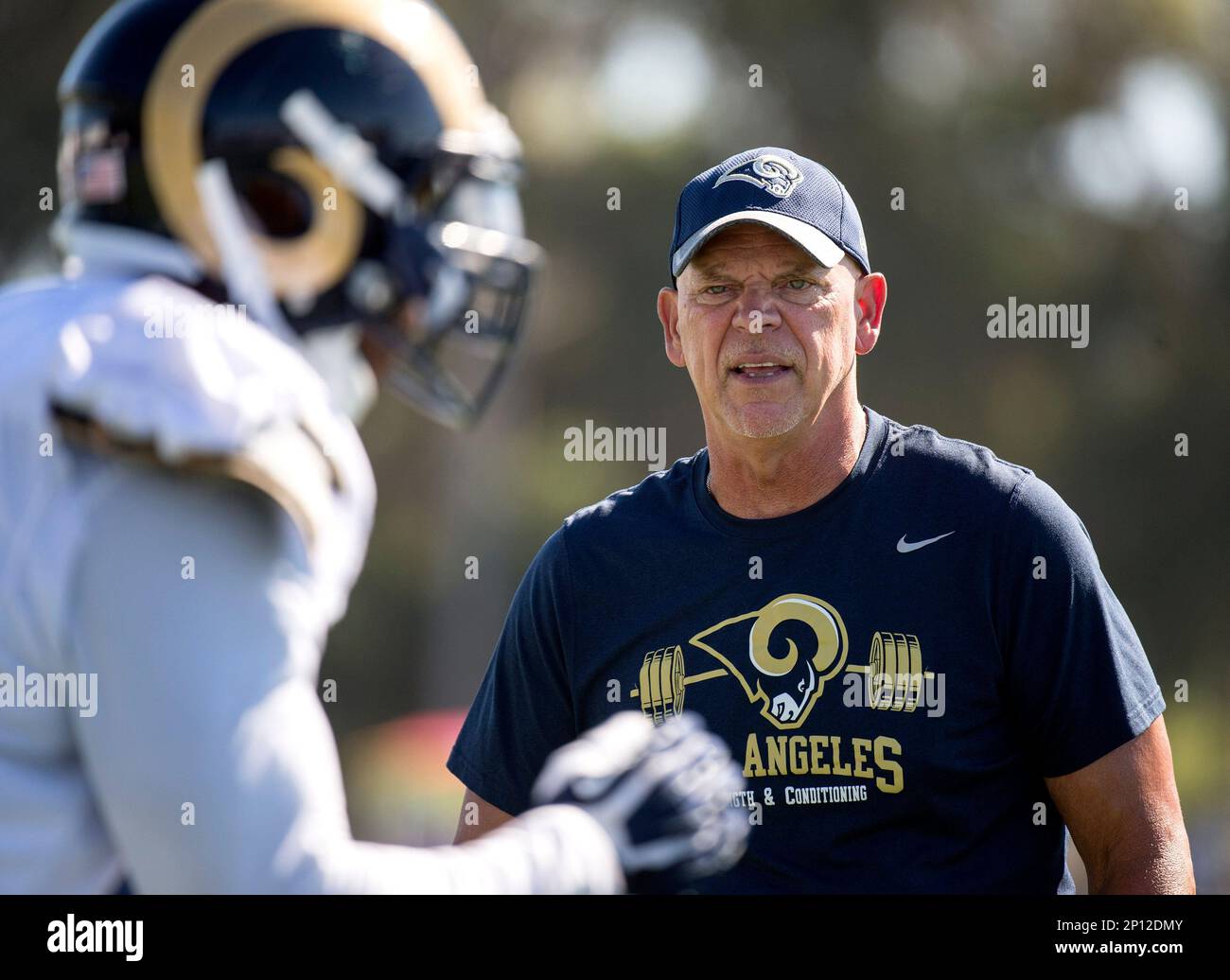 Los Angeles Rams defensive line coach Mike Waufle encourages the ...