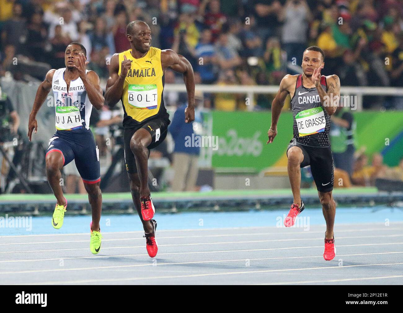 Usain Bolt looks to the camera during the 100 meter race during the men ...