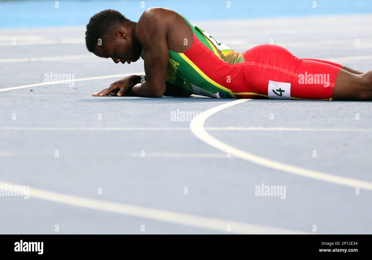 Bralon Taplin of Grenada collapses after competing in the 400 meter ...