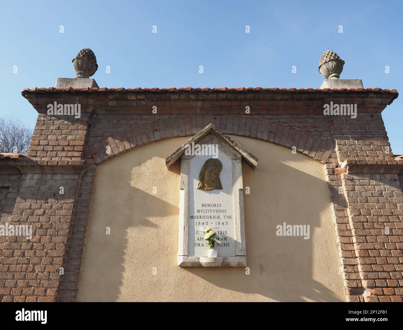 COLLEGNO, ITALY - CIRCA JANUARY 2023: Virgin Mary war memorial with ...