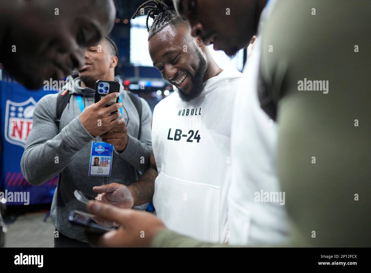 Auburn linebacker Owen Pappoe reacts after competing in the bench press ...