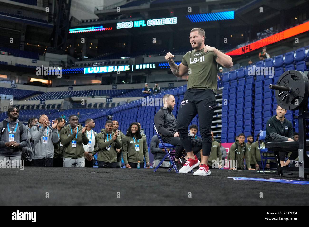 Wisconsin linebacker Nick Herbig reacts after competing in the bench ...