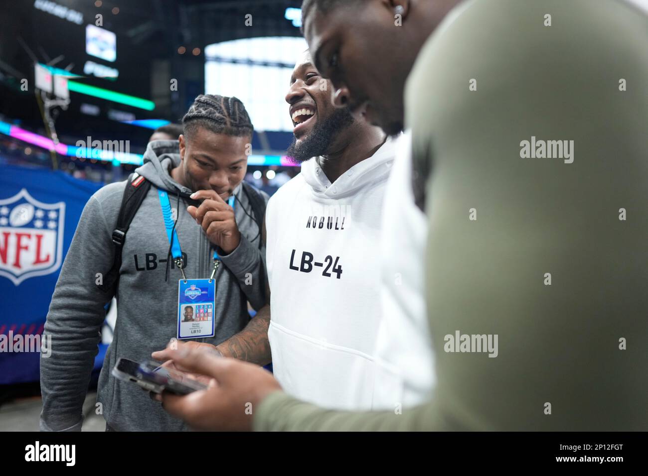 Auburn linebacker Owen Pappoe reacts after competing in the bench press ...