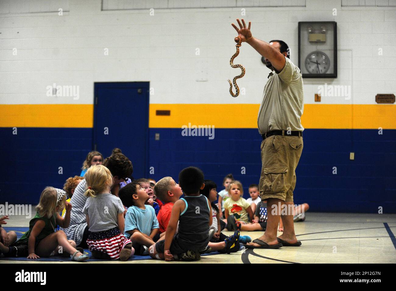 Brendan Finerty, of Wild World Zoo, shows students at Trinity Lutheran ...