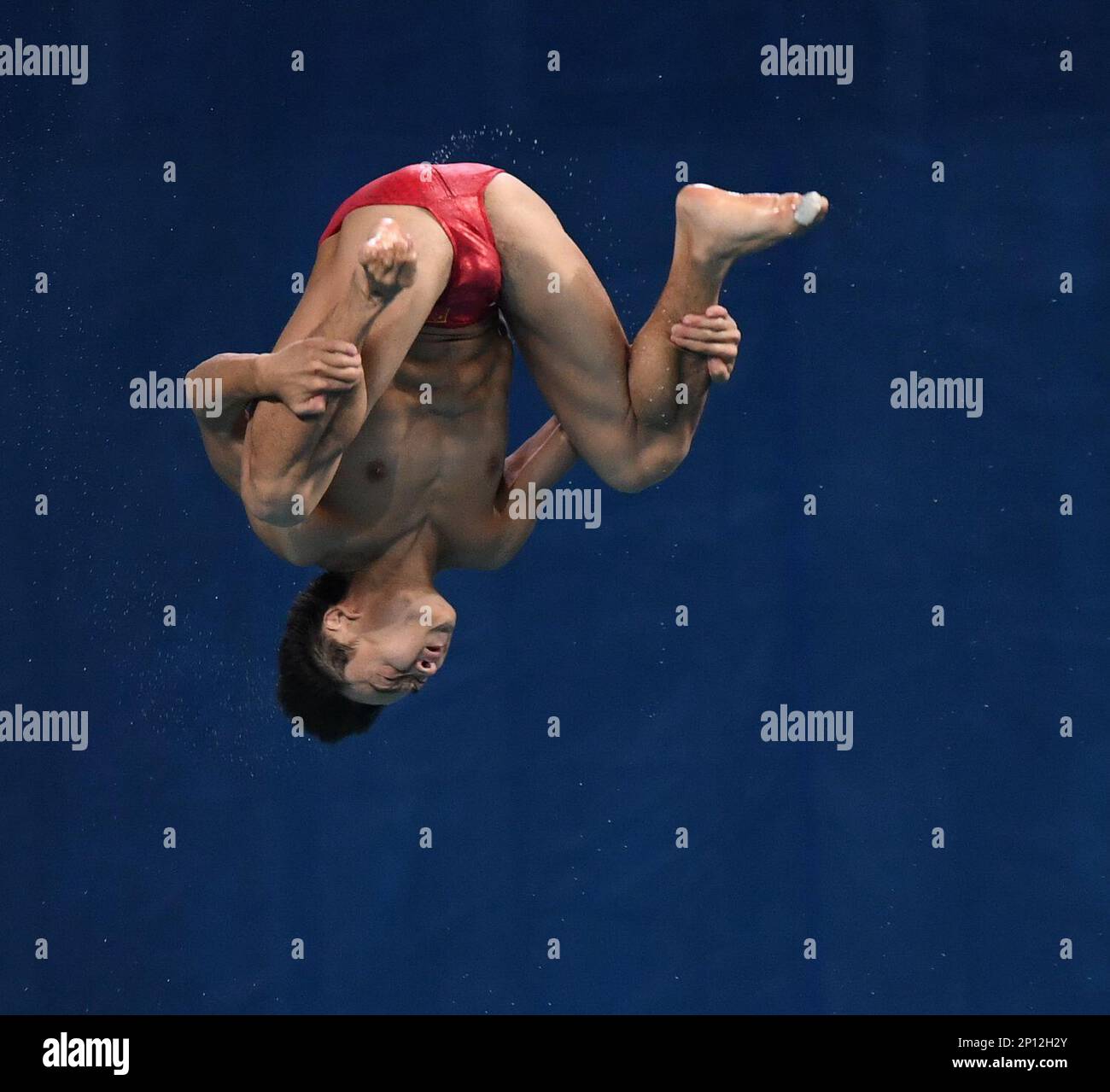 Cao Yuan of China competes during the men's 3m Springboard diving final ...