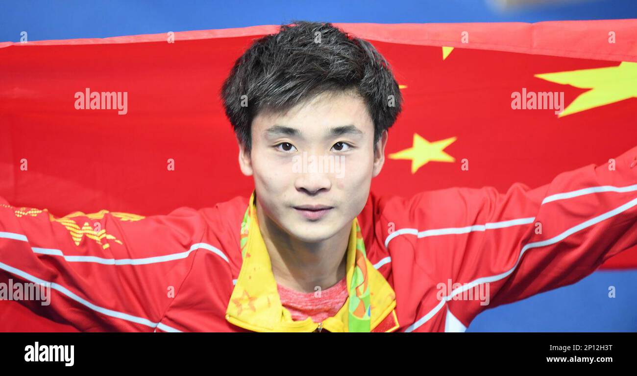 Gold medalist Cao Yuan of China poses with a Chinese national flag ...