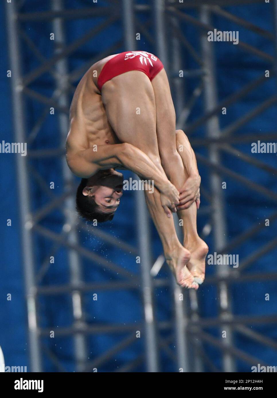 Cao Yuan of China competes during the men's 3m Springboard diving final ...