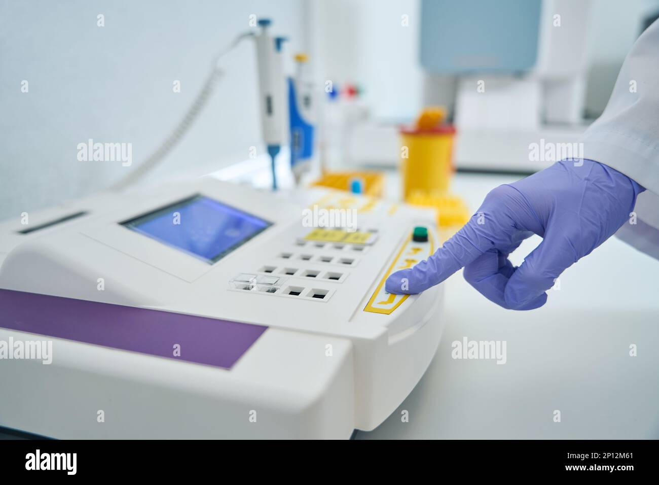 Researcher starts coagulometer, device is designed to determine blood ...