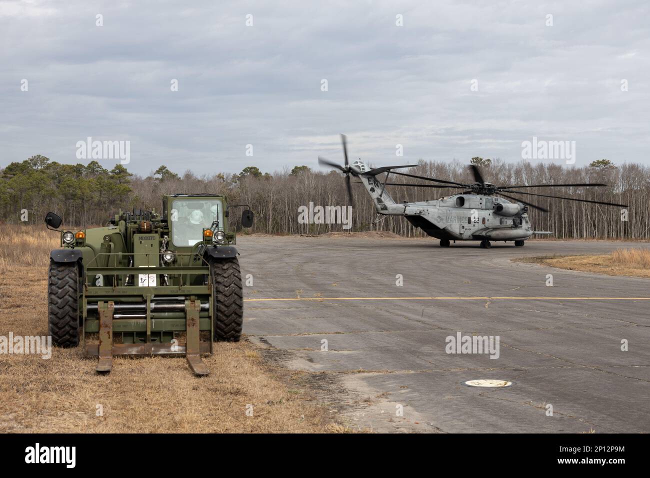 U.S. Marines with 2nd Marine Aircraft Wing (MAW) unload equipment from ...