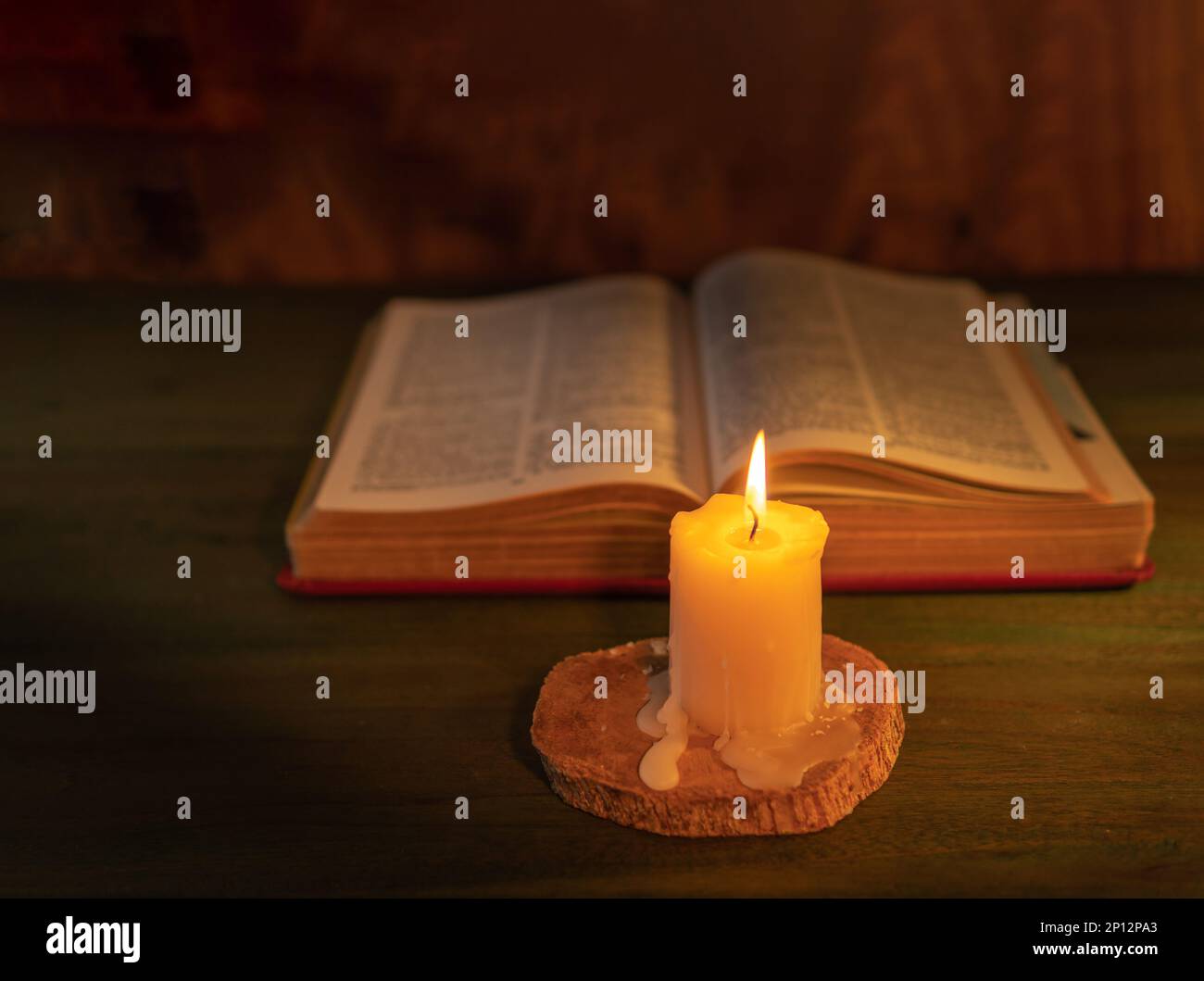 Open bible and candle hi-res stock photography and images - Alamy