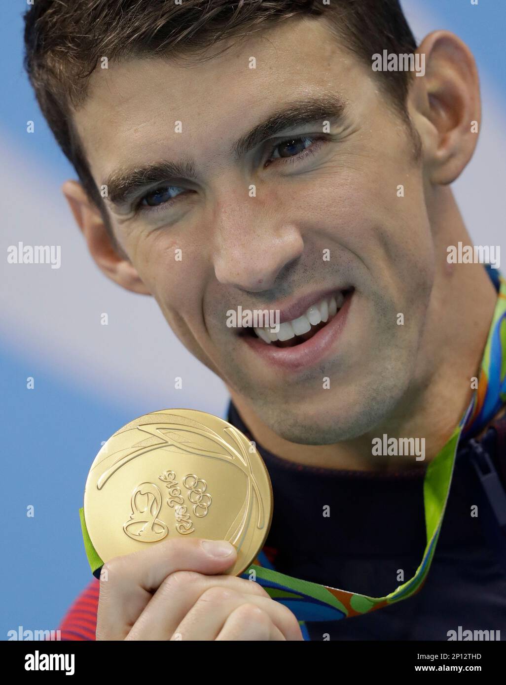United States Michael Phelps Displays His Gold Medal For The Mens 4 X