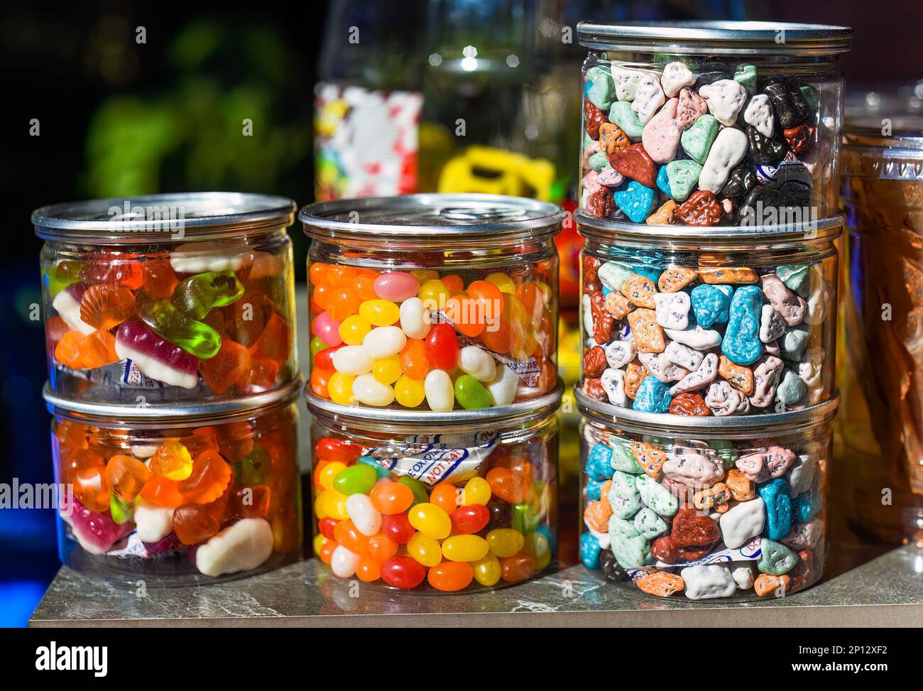 Many colorful candy and lollipops with gum in jars Stock Photo - Alamy
