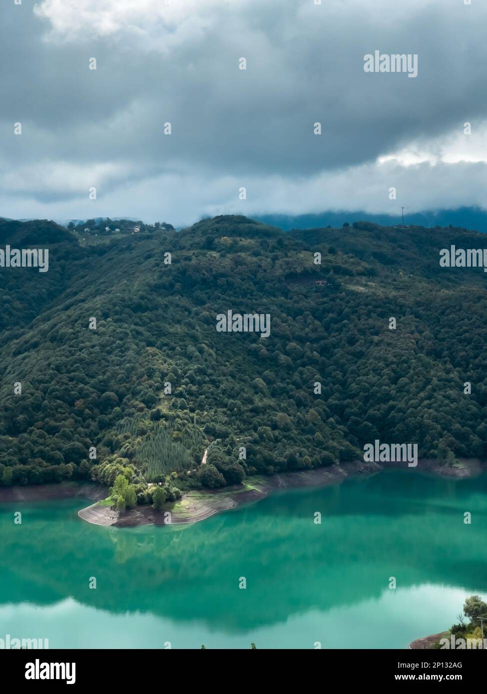 An idyllic green mountain valley with a river in the middle Stock Photo ...