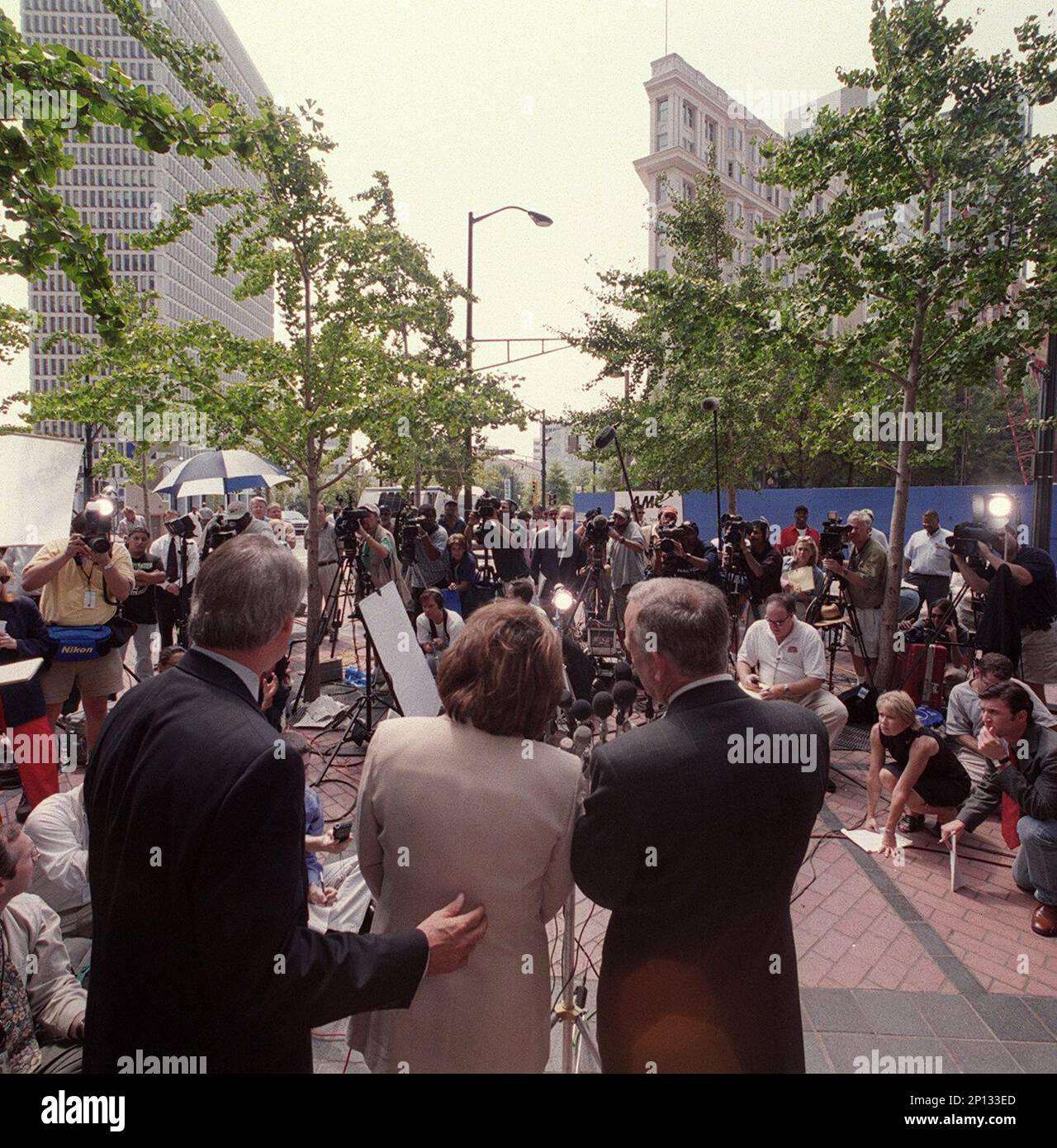 Left to right, backs facing camera: Lin Wood attorney, Patsy Ramsey and ...