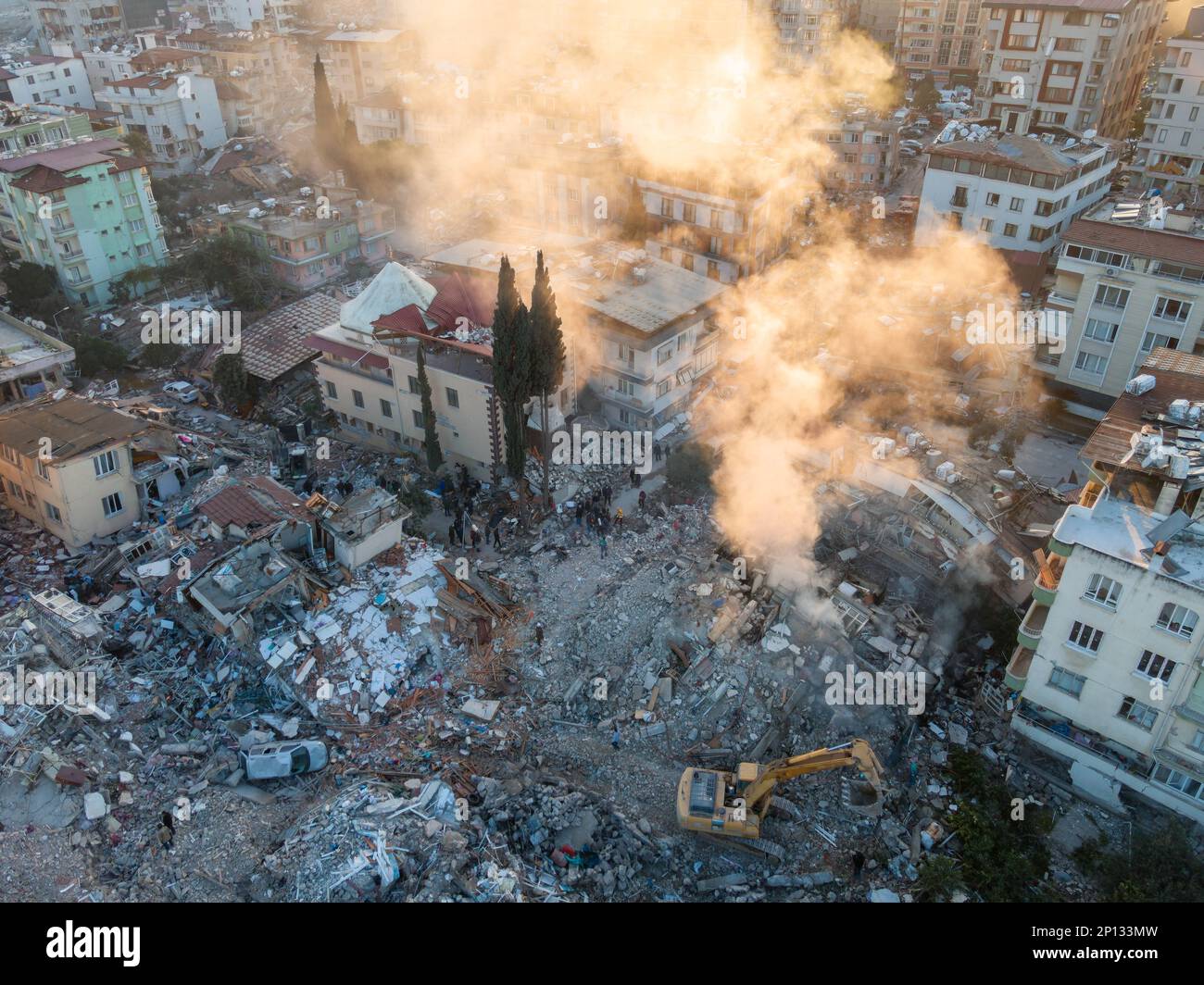 An aerial view of rescuers saving lives around the damaged buildings of ...