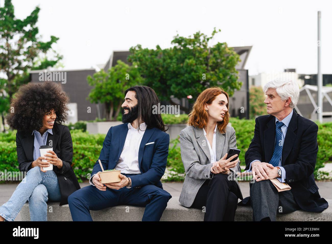 Multiracial business people with different ages having a lunch break ...