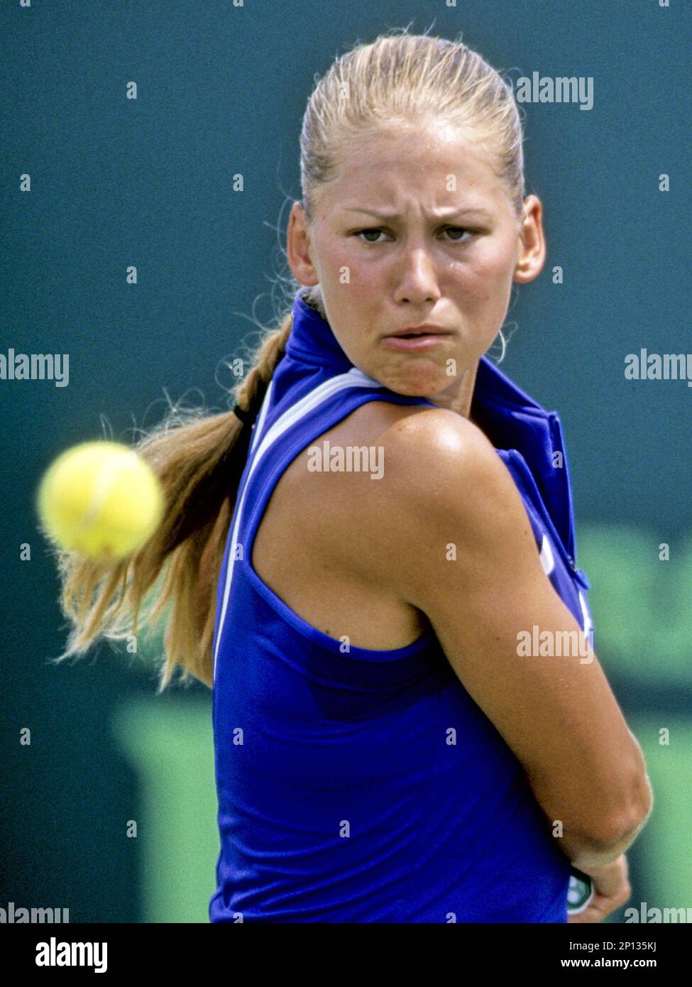 Anna Kournikova returns a backhand in the Ericsson Open tennis ...
