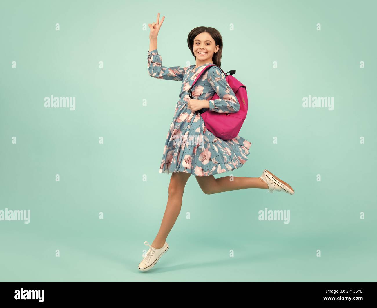 School teen girl in with backpack. Run and jump. Teenager student on ...