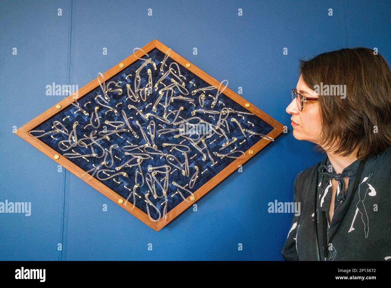 London, UK. 3 March 2023. A staff member views Borosilicate Glass ...