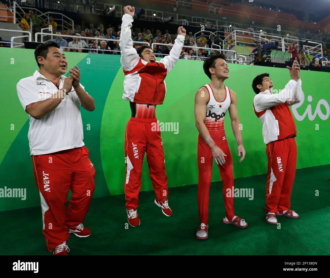 Japanese gymnasts, from right, Koji Yamamuro, Yusuke Tanaka and Kenzo ...
