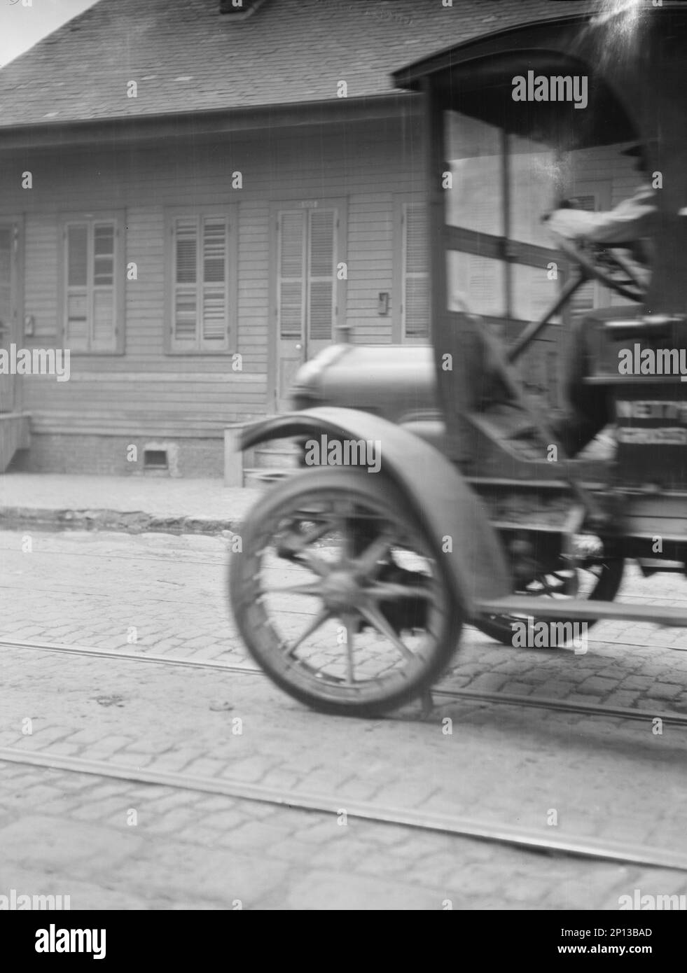 Car driving down a street, New Orleans or Charleston, South Carolina ...