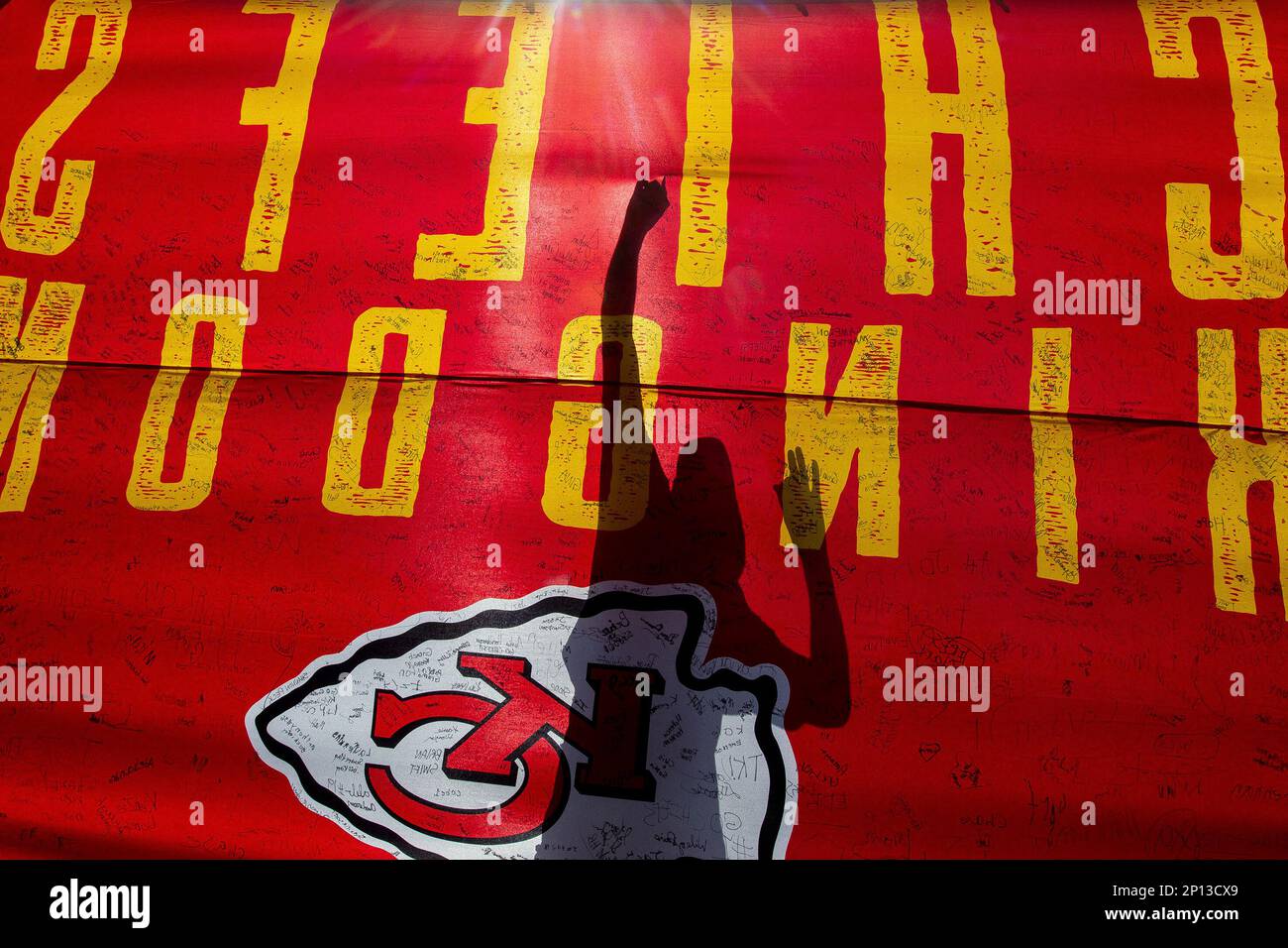 Steven Braden signs the large "Chiefs Kingdom" sign for fans during ...