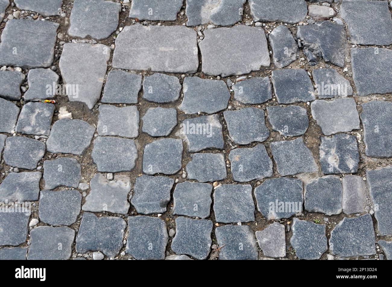 Old stone cobblestones from which the road is paved Stock Photo - Alamy