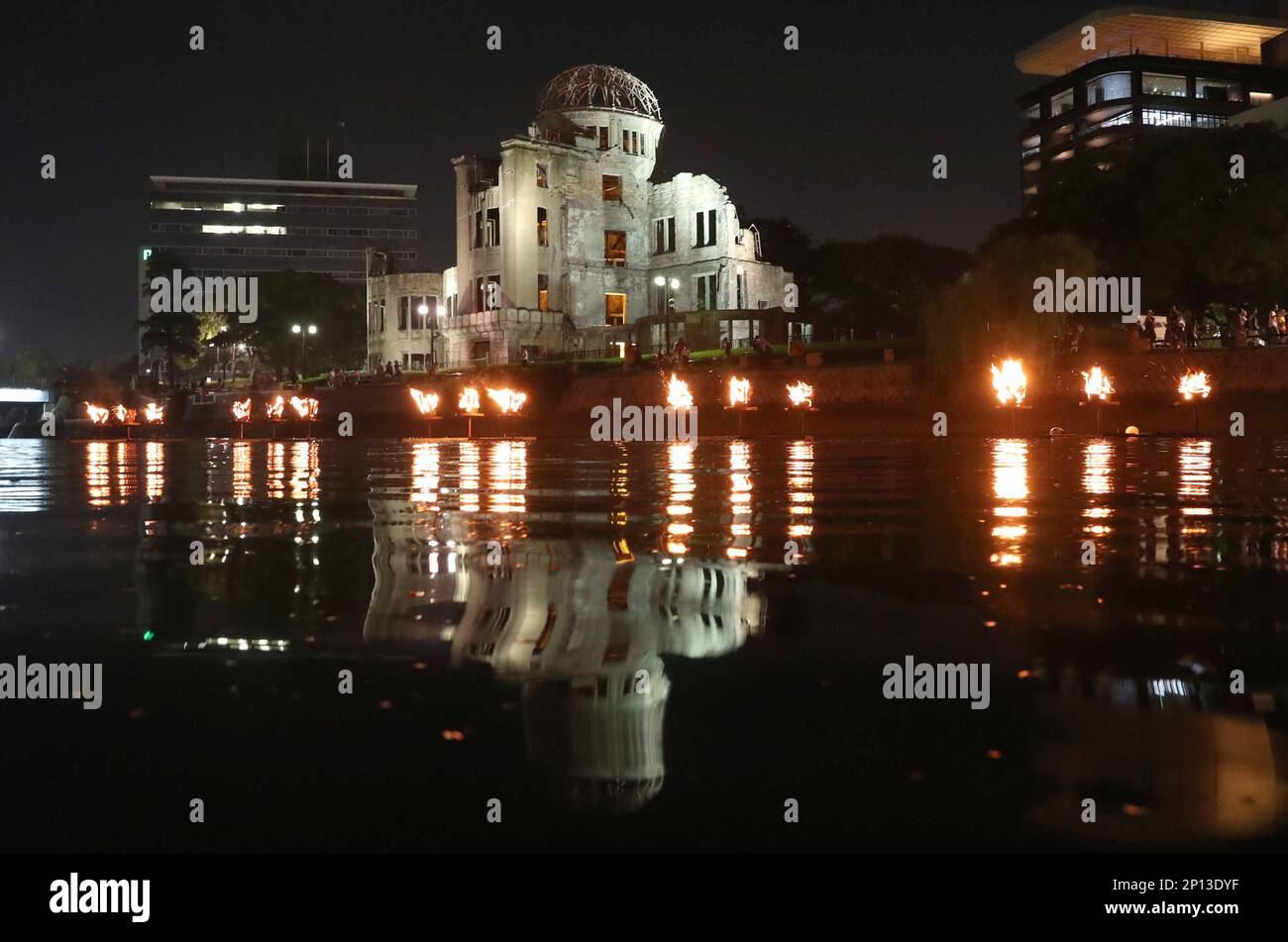 Several boats carrying bonfire are sent floating along the Motoyasu ...